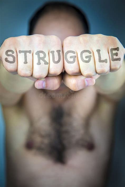 The Word STRUGGLE Written On The Fists Of A Man Stock Photo Image Of