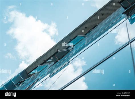 Stunning Low Angle Shot Of An Open High Rise Building Window Framed By