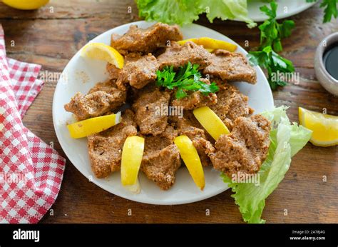 Turkish Food Cig Kofte With Lemon Seasoning Lettuce And Parsley
