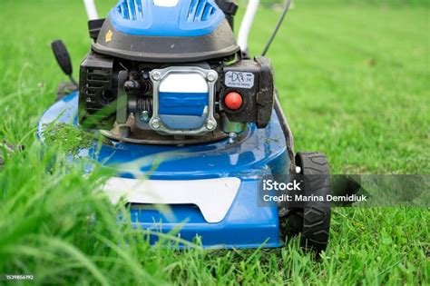 Lawn Mower Cutting Grass Small Grass Cuttings Fly Out Of Lawnmower Grass Clippings Get Spewed