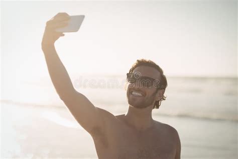 Smiling Shirtless Man Taking Selfie At Beach Stock Image Image Of Foreground Leisure
