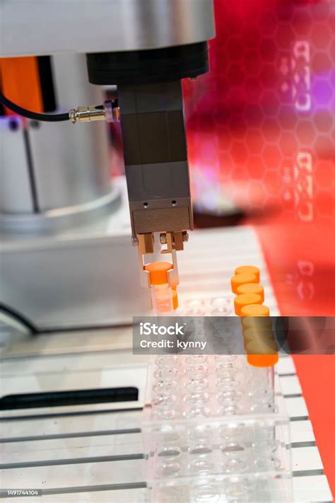Robot Arm With Test Tube For Biological Experiments In Laboratory Stock