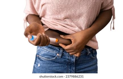 Woman Injecting Epinephrine Using Autoinjector Syringe Stock Photo