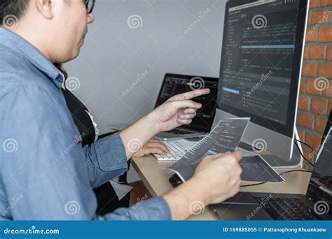 Two Professional Programmer Cooperating And Working On Web Site Project In A Software Developing