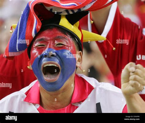 A Fan Of The South Korean National Soccer Team Cheers During The Fifa