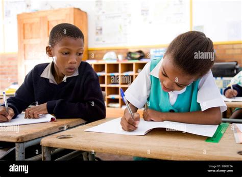 Boy Copying Schoolwork Stock Photo Alamy