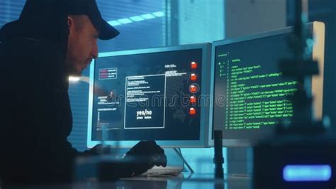 A Hacker In A Black Hoodie And Gloves Is Spying In The Laboratory