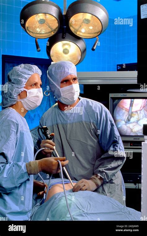 Surgeons Performing A Laparoscopic Operation On A Patients Abdomen A