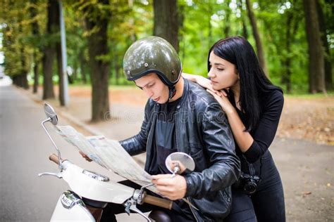 Image Of Young Happy Loving Couple Holding Map Outdoors Near Scooter