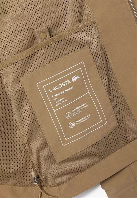 Buy Lacoste Short Showerproof Snaps Down Jacket Online ZALORA Malaysia