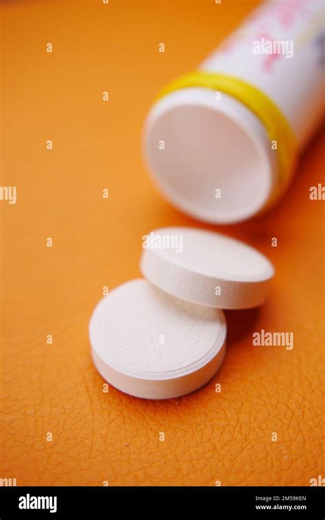Effervescent Soluble Tablet Pills On Orange Purple Background Stock