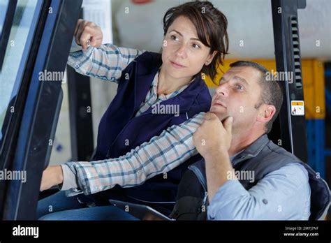 Man Giving Instructions To Female Forklift Driver Stock Photo Alamy
