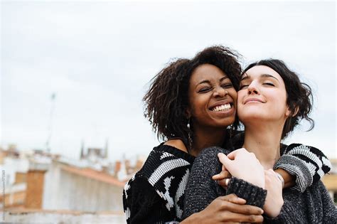 Affectionate Embrace Between Two Female Friends By Stocksy