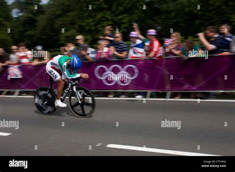 Iranian Alireza Haghi Races Past Fans Lining The Route Through Bushy