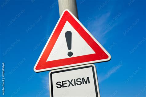 Sexism Traffic Sign With Exclamation Mark To Alert Warn Caution