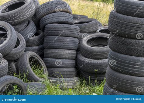 Old Car Tires Worn Tread Worn Rubber A Pile Of Old Car Wheels A