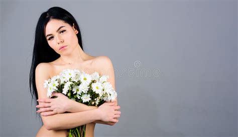 Woman Hiding Her Breasts Covers With Bouquet Cancer Of Breast Concept