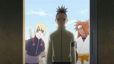 Two Men Standing In Front Of An Open Door With Their Backs Turned To The Camera