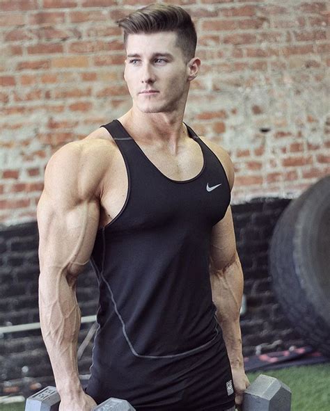Wearing A Tight Muscle Shirt While Training To Show Off His Big Biceps