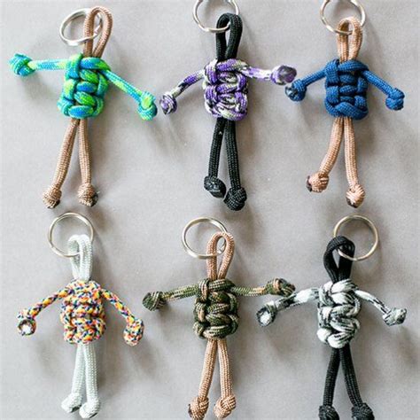 Six Keychains With Different Designs And Colors On Them All In The