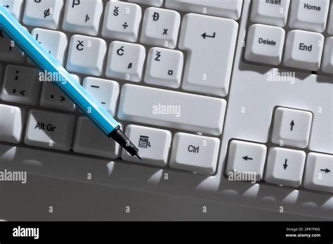 Important Messages Written On Keyboard Buttons With Pen Placed Between Them Crutial