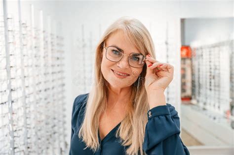 Looking At The Camera Woman In Store Trying New Glasses Stock Image