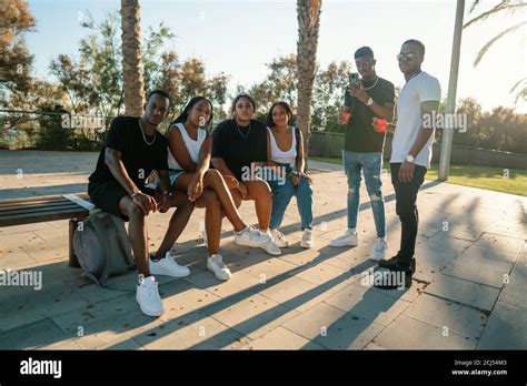 Group Of Young Modern African Black Friends Happily Sitting Together