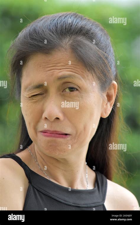A Winking Filipina Female Senior Stock Photo Alamy