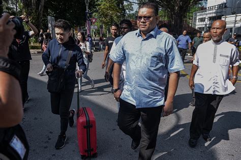 Umnos Lokman Adam Brings Suitcase To Police Questioning In