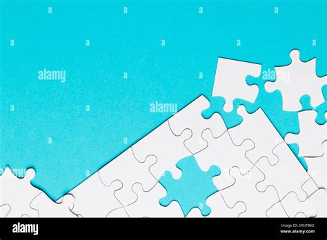 White Jigsaw Puzzle Piece Blue Backdrop Stock Photo Alamy