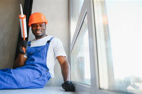 Young Male Worker Applying Silicone Sealant With Silicone Gun Stock Image Image Of Installer