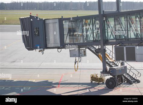 Airport jetway, jet bridge, jet way - a collapsible structure that ...