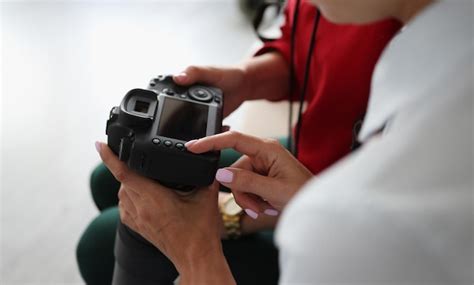 Premium Photo Two Women Hold Camera In Their Hands