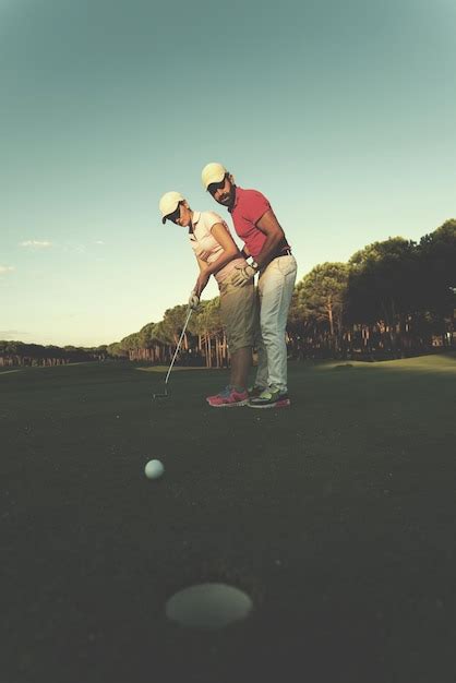 Premium Photo Male Golf Instructor Teaching Female Golf Player