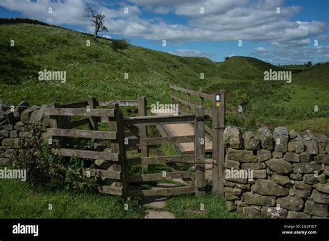 gate at a field wall along hadrian s wall path with the omnipresent