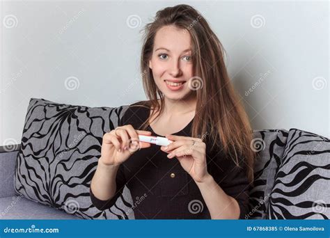 Young Woman With A Pregnancy Test The Happiness Of Becoming A Mother