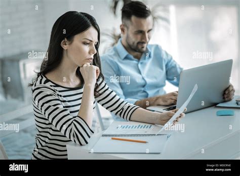 Pensive Serious Woman Reading Document Stock Photo Alamy