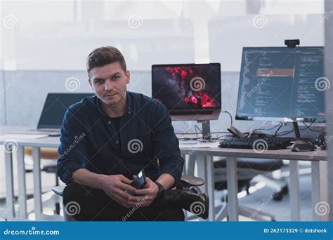 Programming Man Working On Computer In It Office Sitting At Desk Writing Codes Stock Image