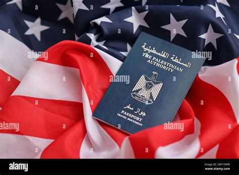 Blue Palestinian Authority Passport On United States National Flag