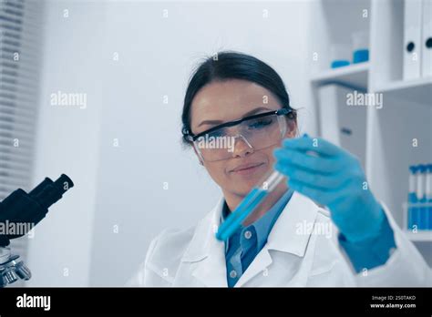 In A Wellorganized Lab An Experienced Scientist Analyzes A Complex Chemical Solution With