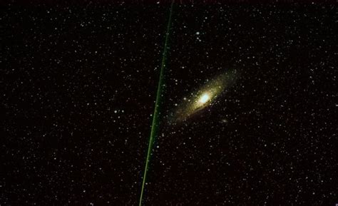 andromeda galaxy and a bright meteor photorator