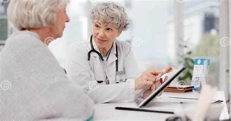 Senior Doctor Tablet And Talking To Patient For Healthcare