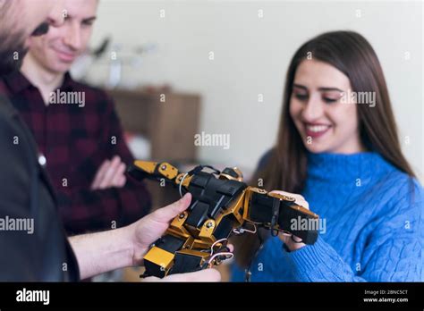 Scientists Engineers Designing Small Human Robot Setting Artificial