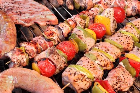 Assorted Roasted Meat With Vegetable On Barbecue Flaming Grill Stock