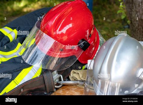 Firefighter Uniform With Red Helmet Close Up Image Of A Red Helmet Of
