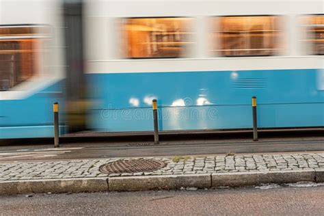 Long Exposure Photo Of A Blue And White Tram Passing Editorial Photography Image Of Urban