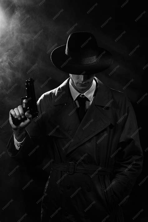 Premium Photo A Dark Silhouette Of A Male Detective In A Coat And Hat