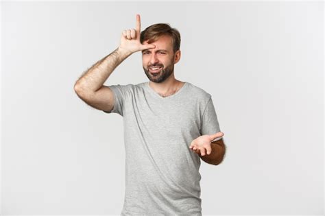 Premium Photo Portrait Of Arrogant Man In Gray T Shirt Mocking