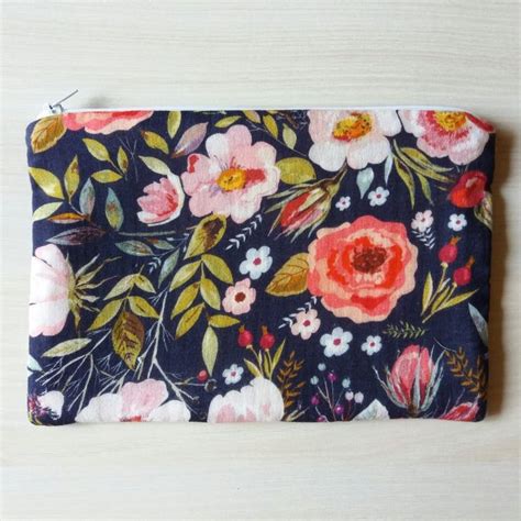 An Image Of A Flowered Purse On A Table