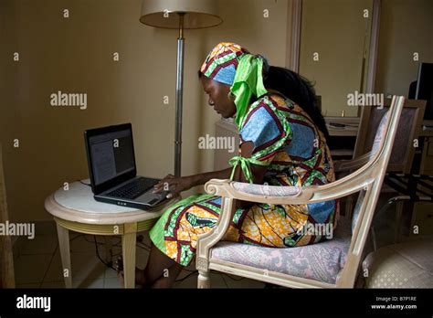 Woman In Traditional Dress Using Laptop Computer Yaound Cameroon West Africa Stock Photo Alamy
